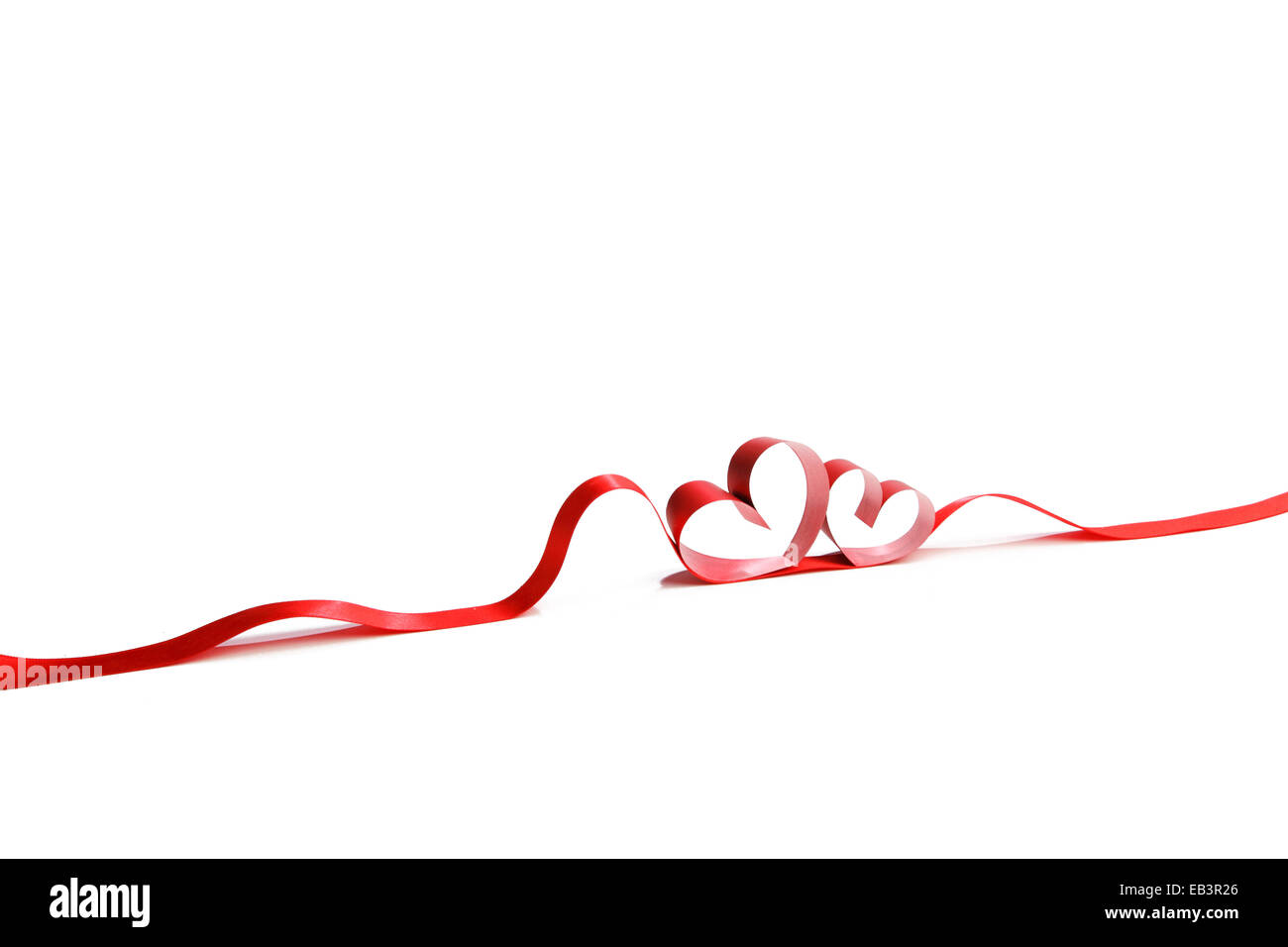 Heart shaped red ribbon isolated on white background Stock Photo - Alamy