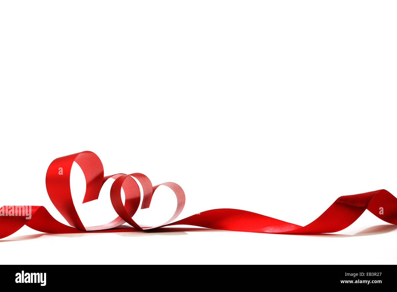 Heart shaped red ribbon isolated on white background Stock Photo - Alamy