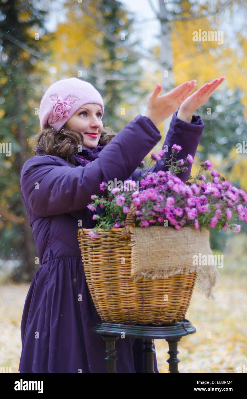 The girl catches the first snow Stock Photo - Alamy