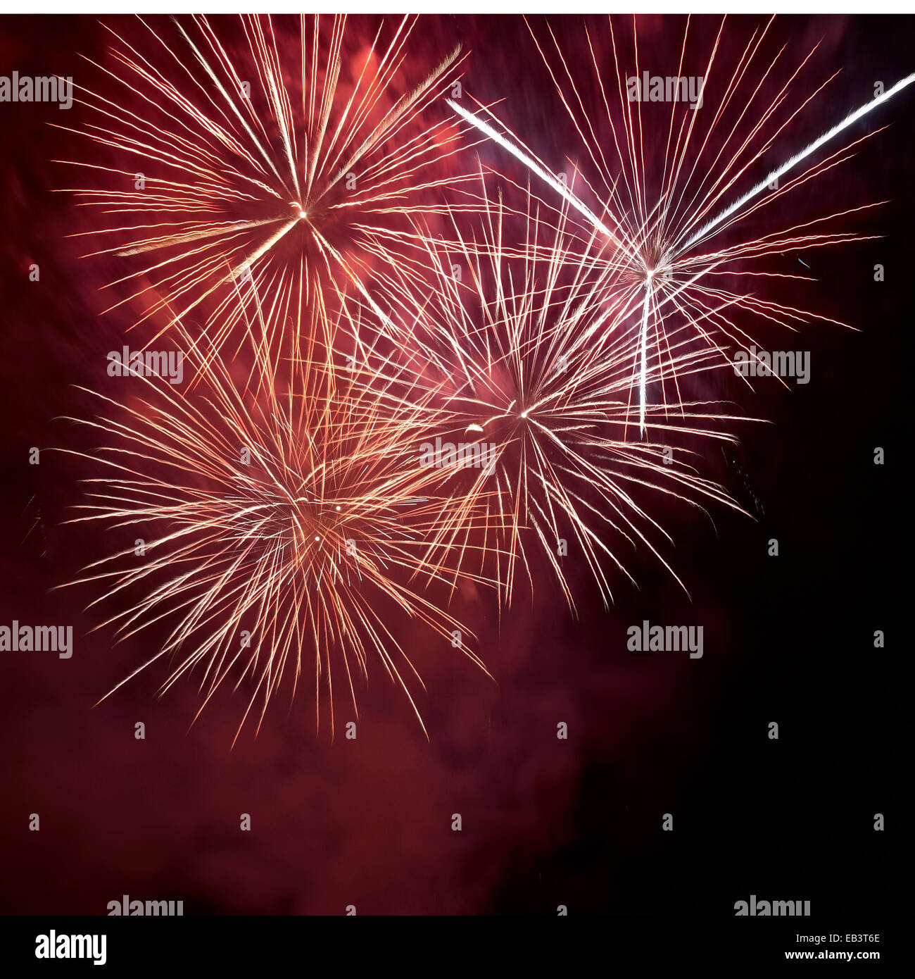 Red colorful fireworks on the black sky background. Holiday celebration ...