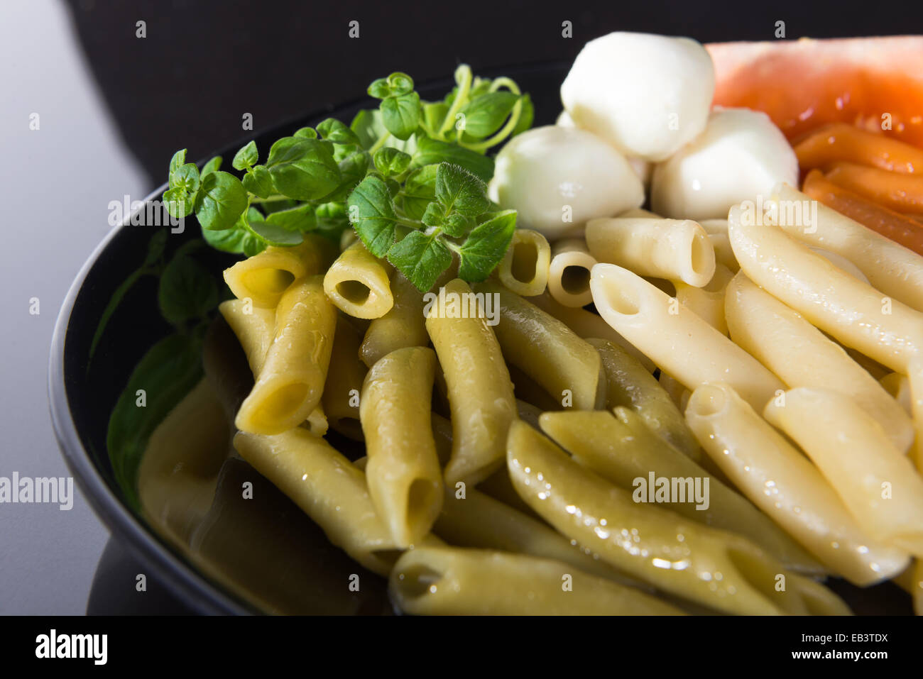 Italian pasta color - green, white and red - Penne lisce Stock Photo ...
