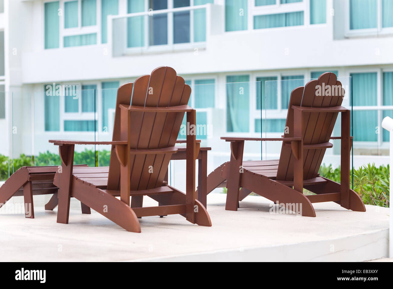 Wooden sun chair at luxury resort near hotel Stock Photo - Alamy