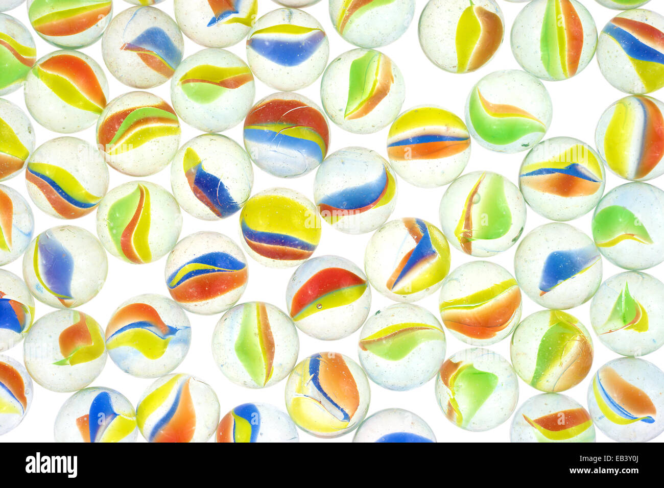 A group of small glass marbles illuminated on a white background Stock ...