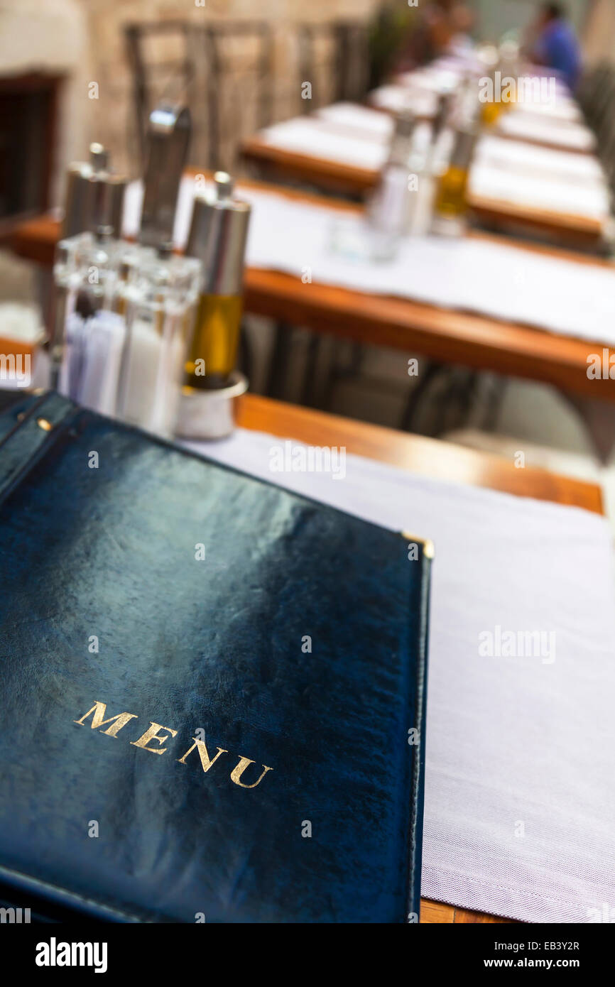 A menu laid on a restaurant table Stock Photo - Alamy