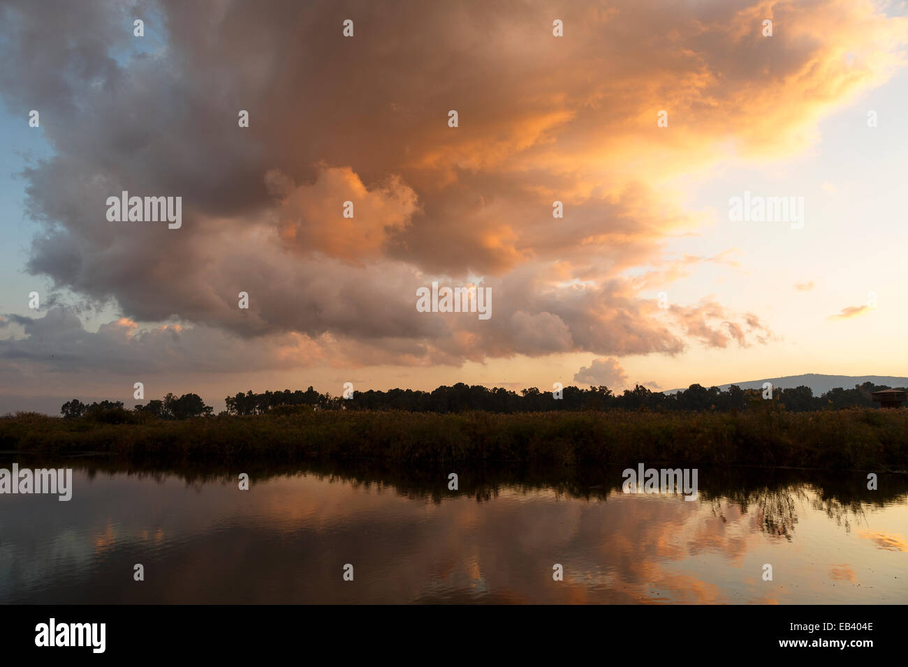 Sunset and lake. Hula Nature Reserve. Hula Valley. Israel Stock Photo ...