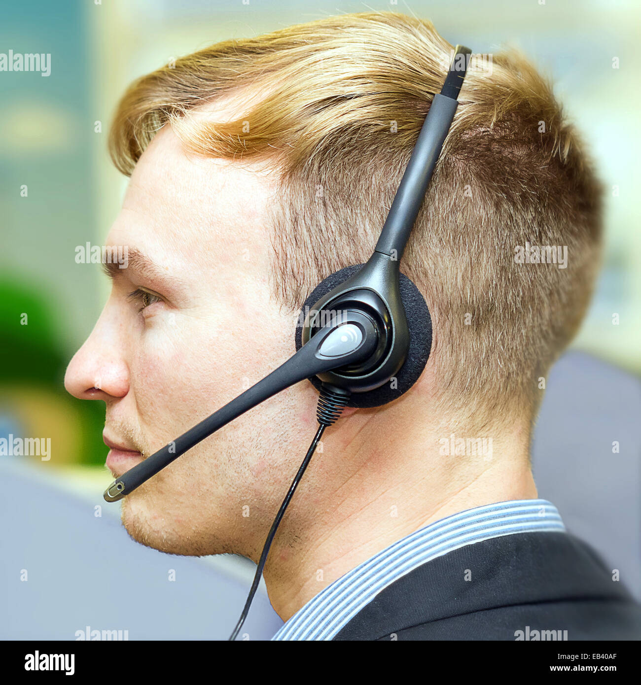 Call Centre staff - young blond man wearing an audio headset Stock ...