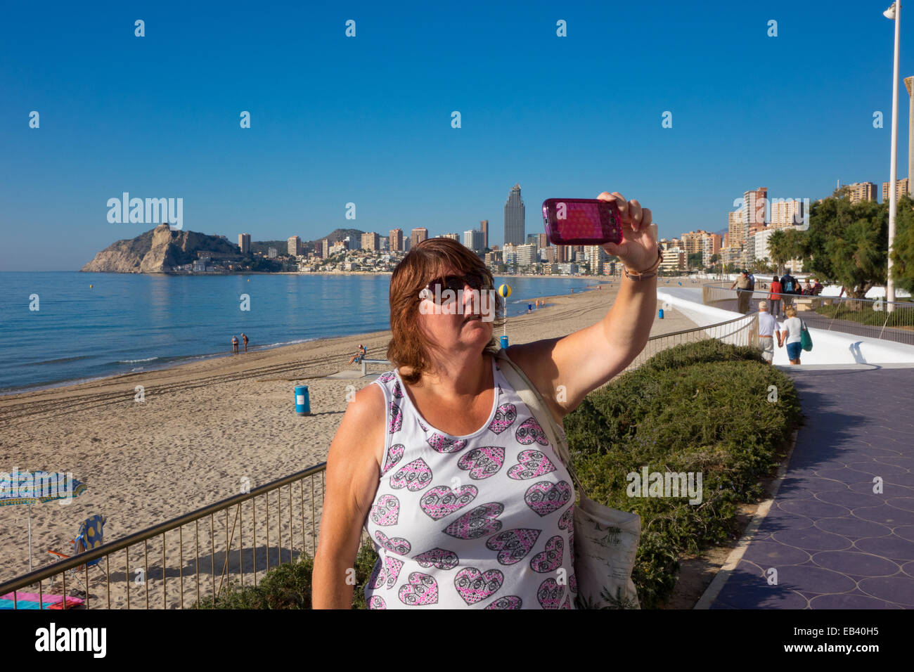 Benidorm, Costa Blanca, Spain, Europe. Woman tourist taking selfie ...
