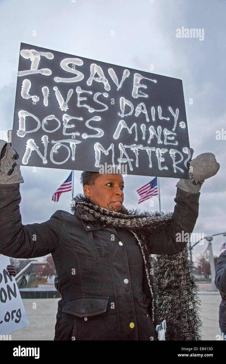 Detroit, Michigan, USA. 25th Nov, 2014. An African-American nurse joins ...
