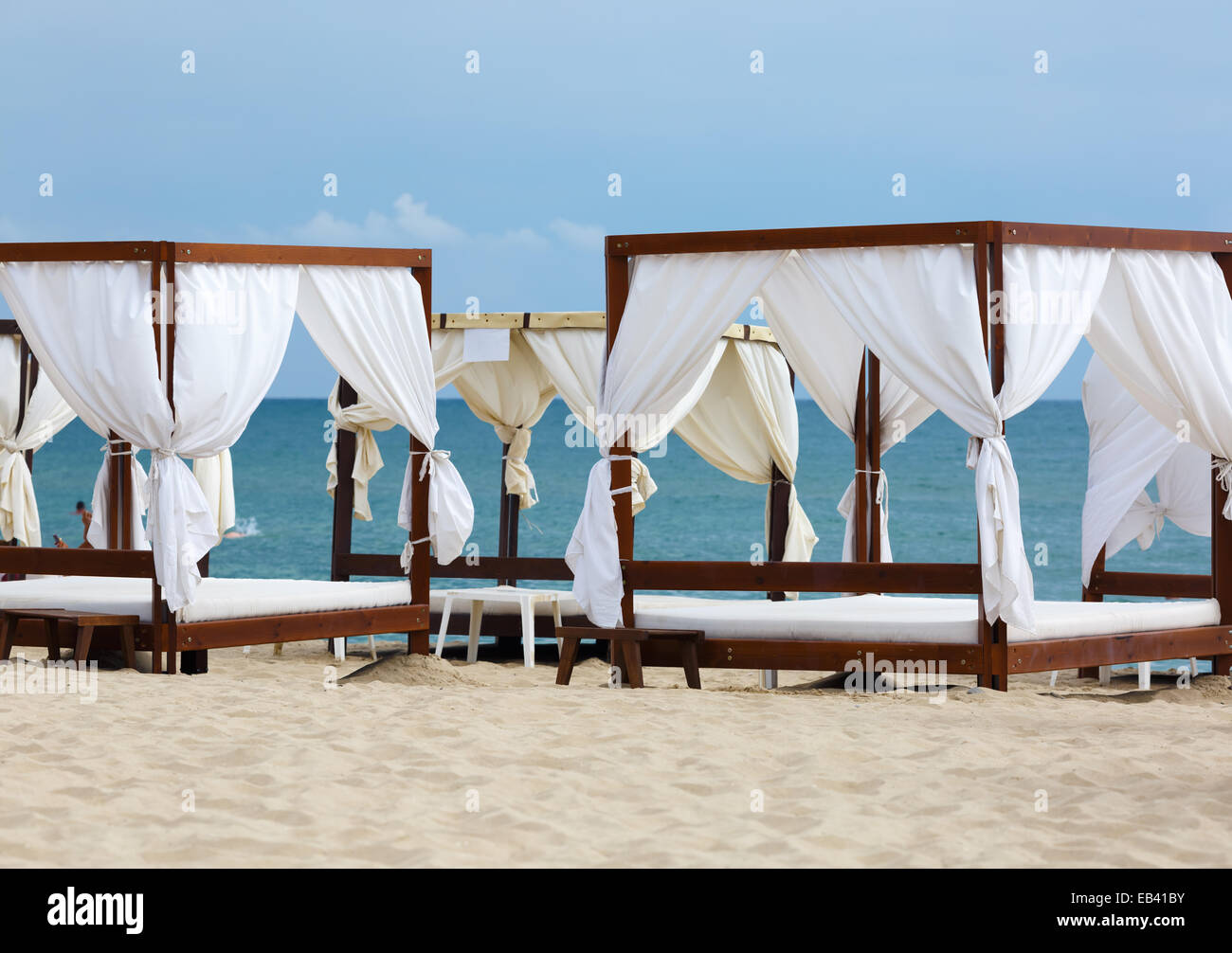 Several canopies on the beach. Focus on the main subject of the picture ...