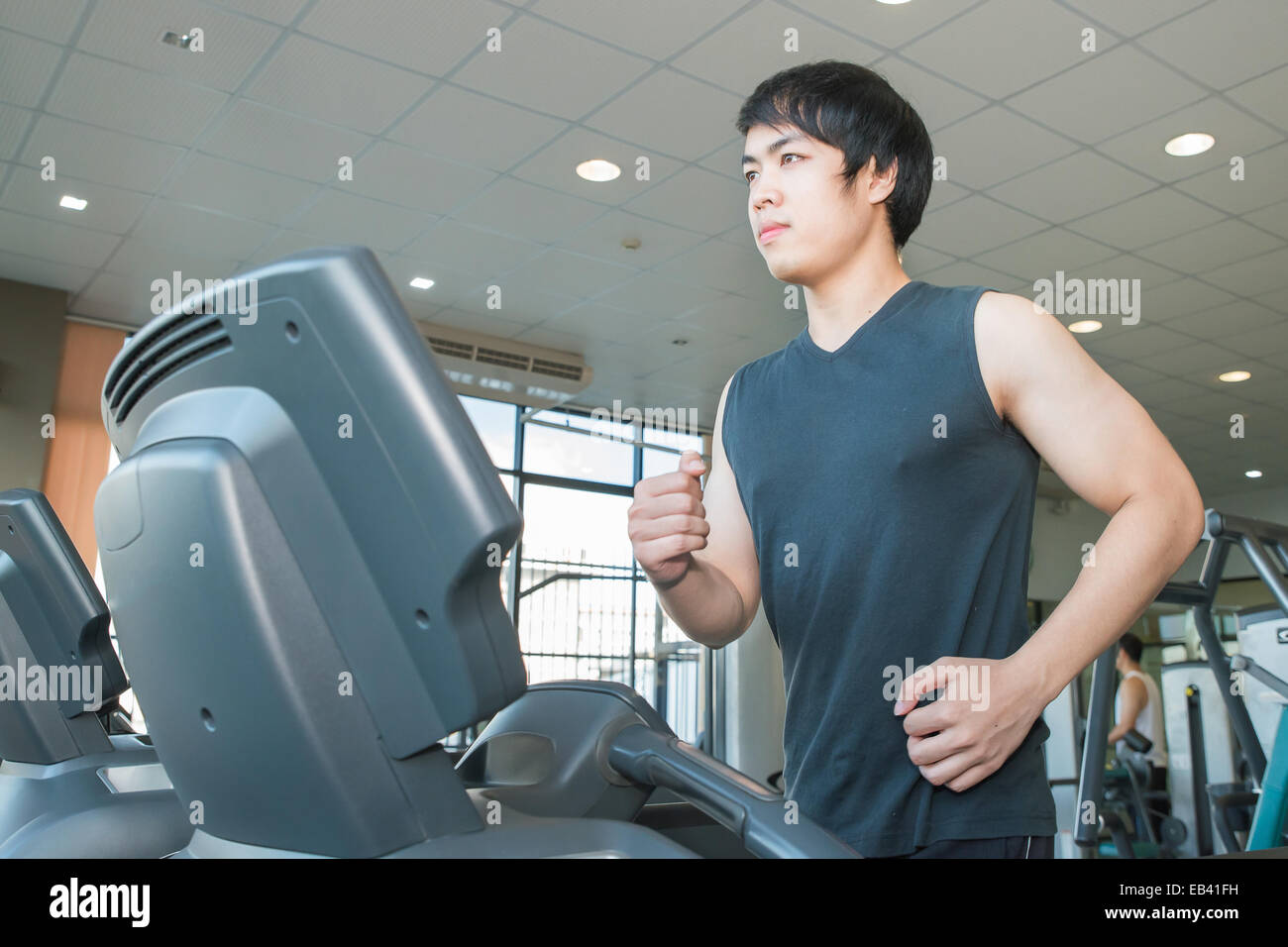Muscular man running on treadmill hi-res stock photography and images ...