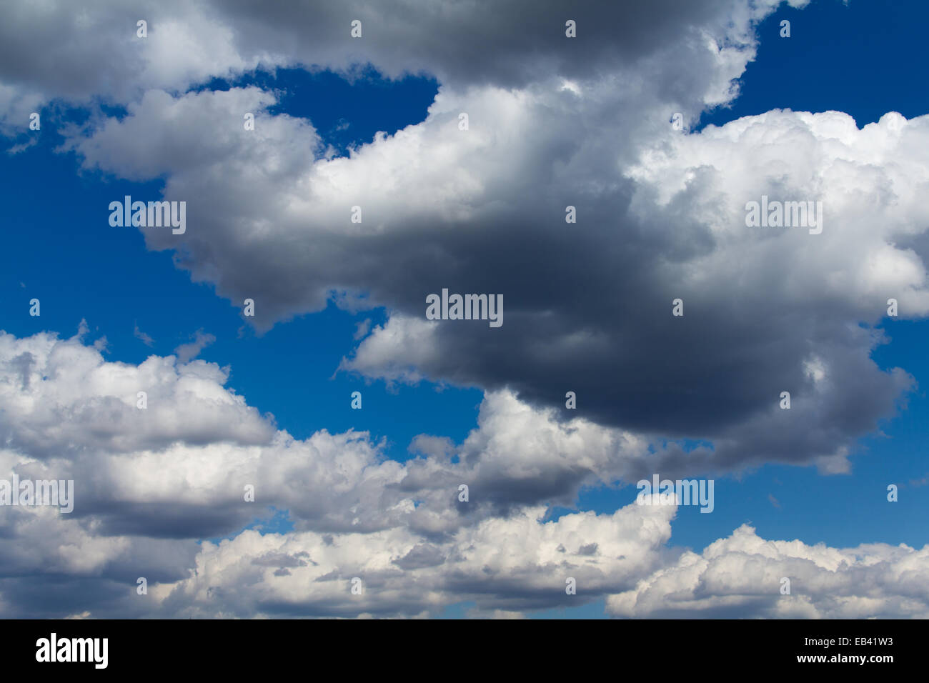 Deep blue sky with rain cloud closeup Stock Photo - Alamy