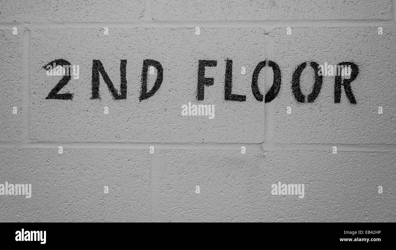 A hand painted 2nd floor sign on a brick wall Stock Photo - Alamy