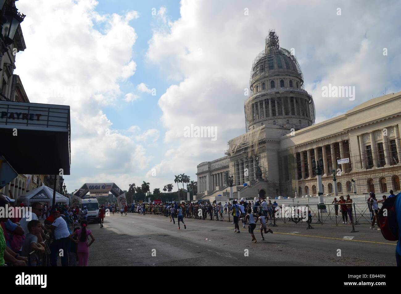 Athletes in Havana, Cuba participate reach the finish line of the ...