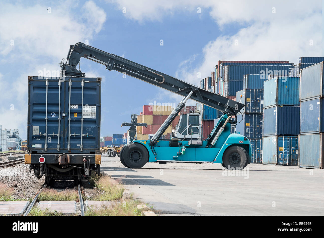 forklift handling container box loading to freight train Stock Photo ...