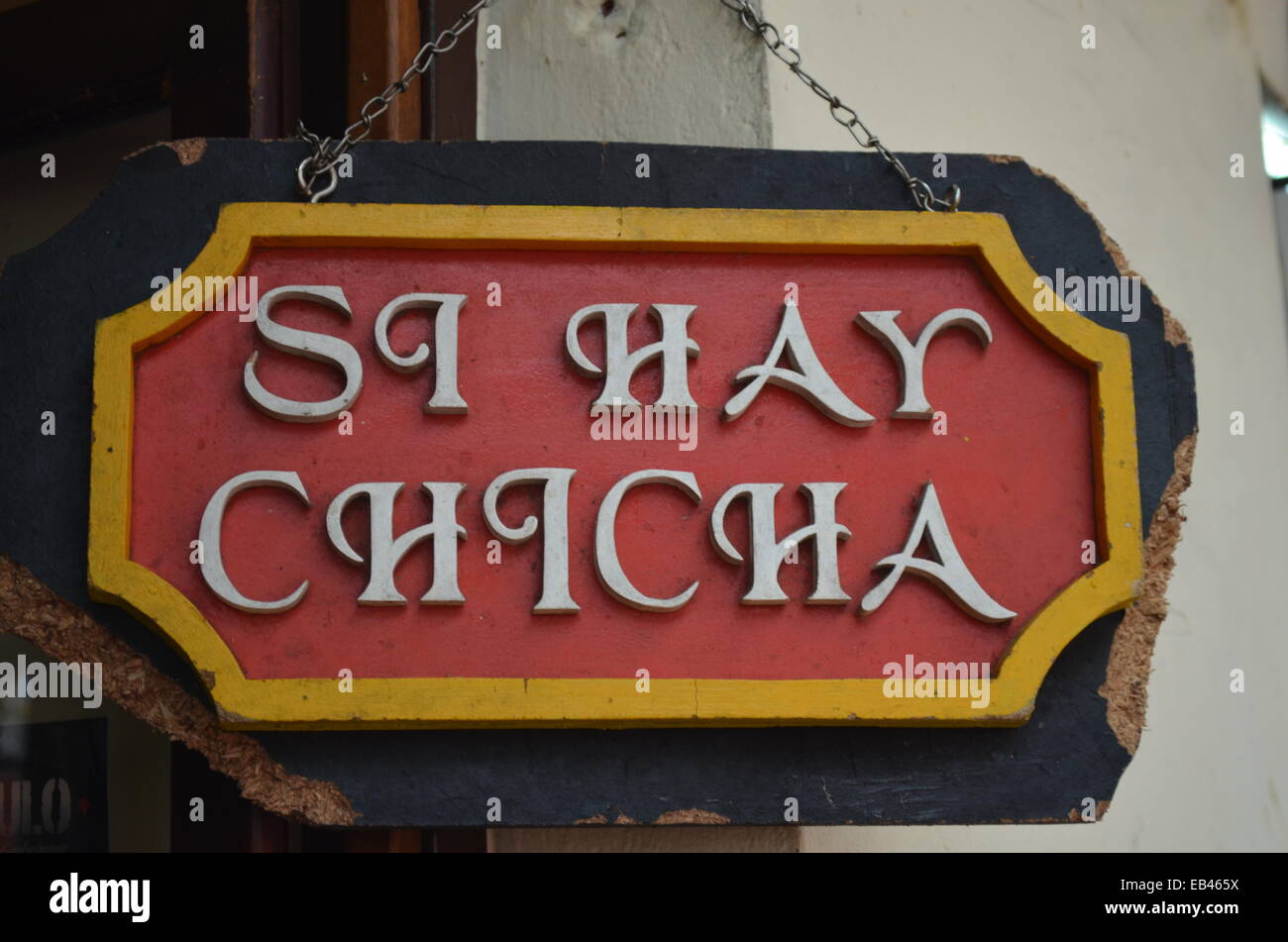Sign hanging over the entrance to a bar in the La Candelaria district ...