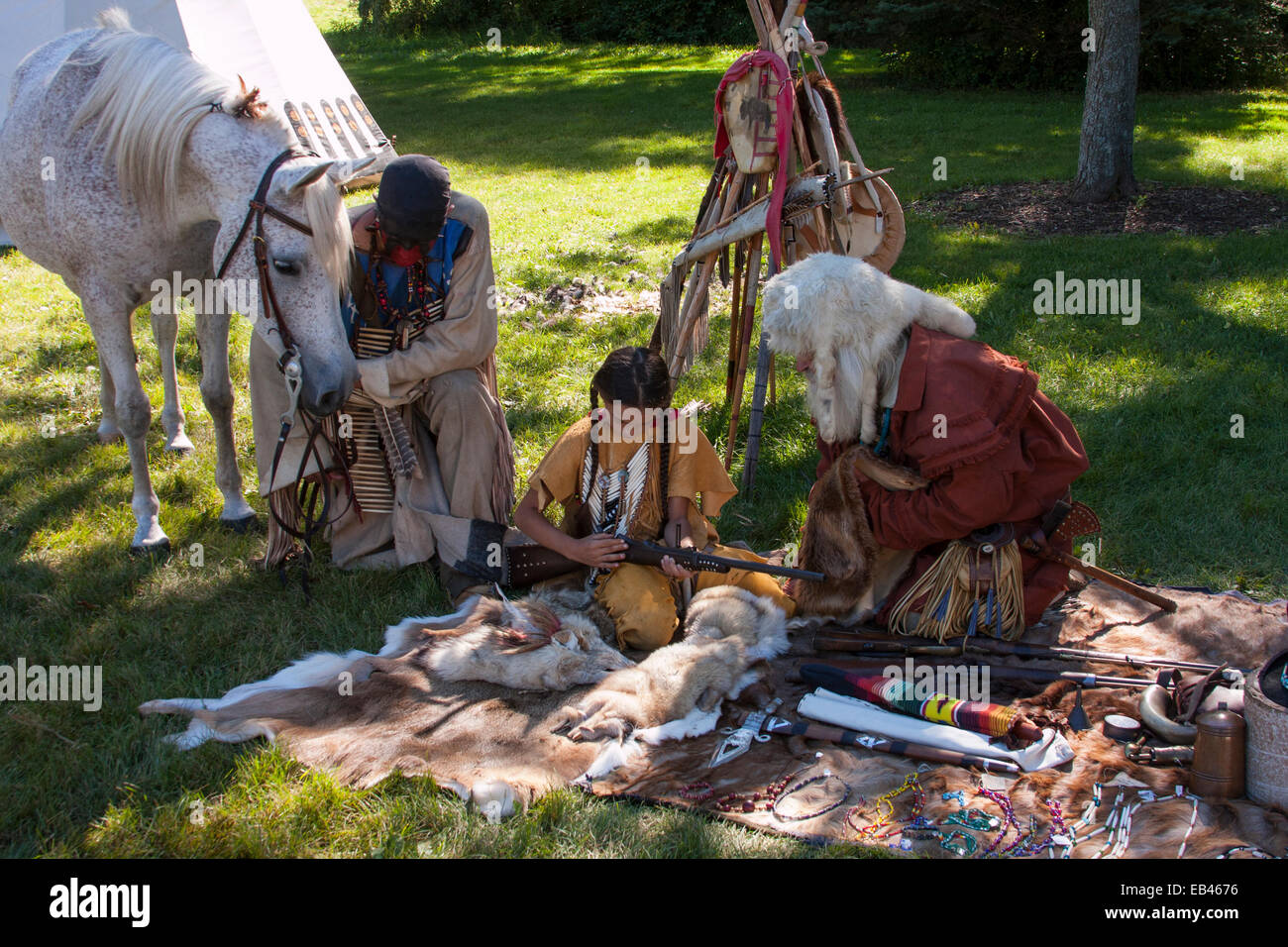 Native American Indian man and son trading furs for a gun with a ...
