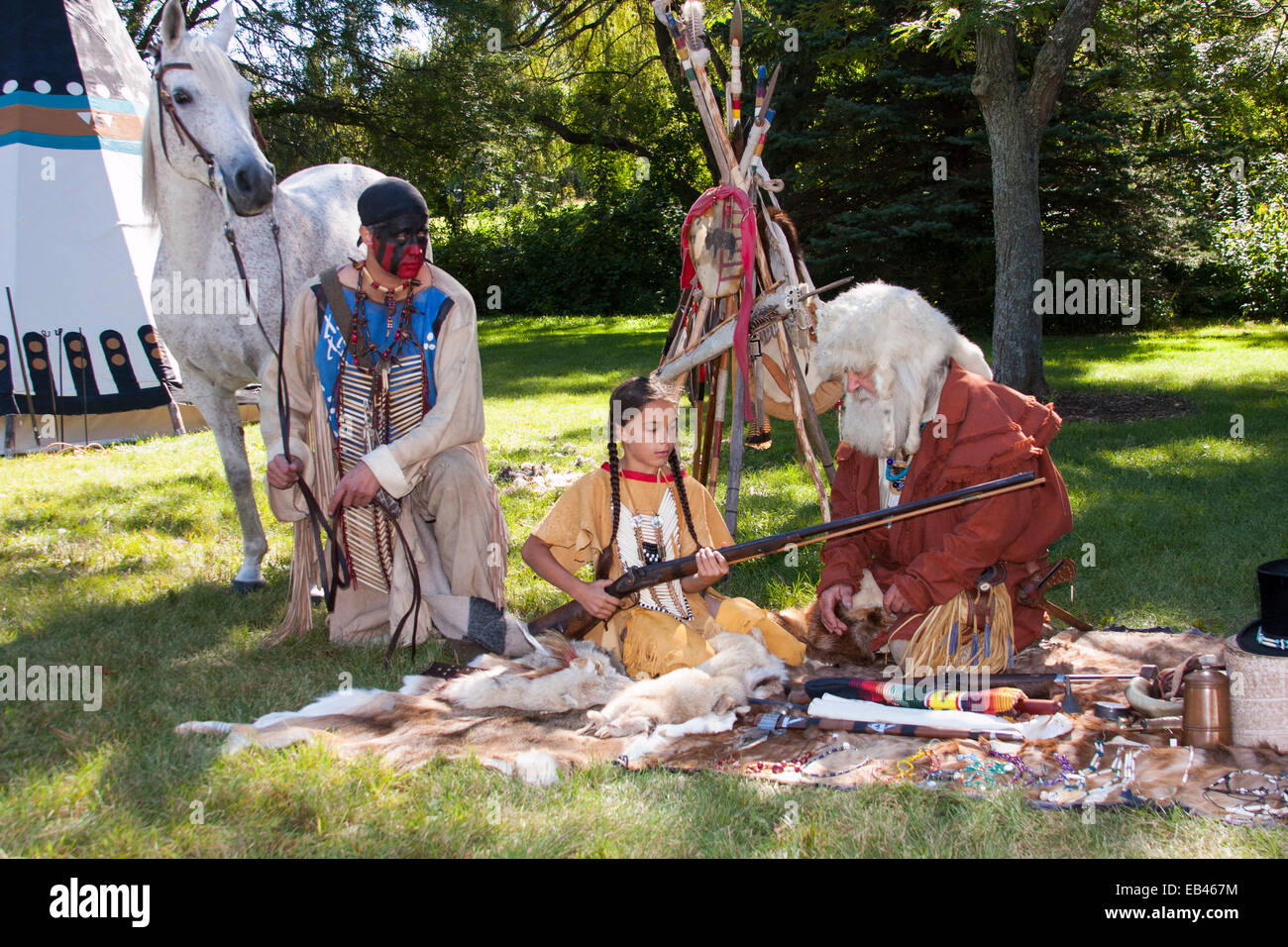 Native American Indian man and son trading for a gun with a mountain ...