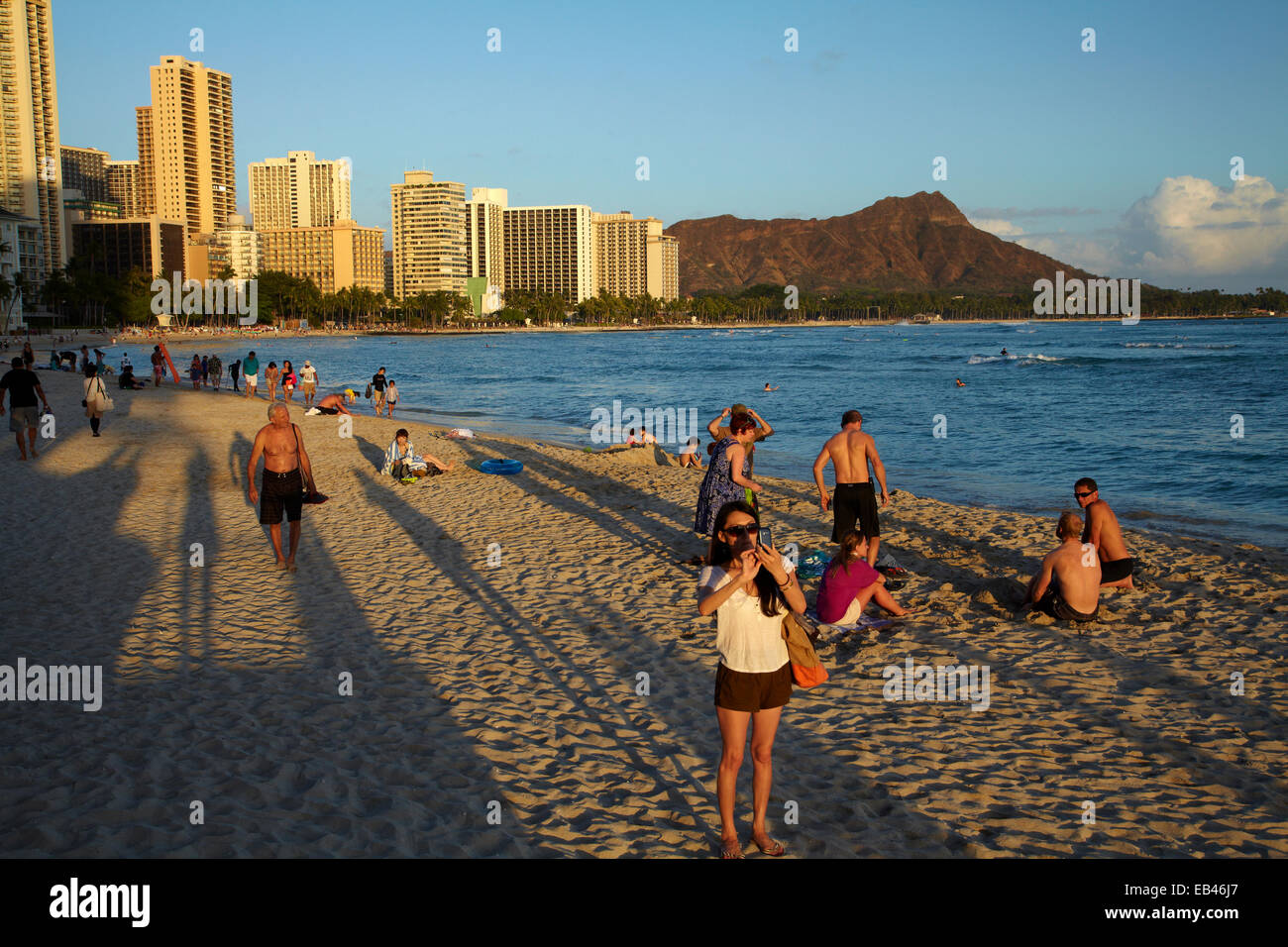 People on Waikiki Beach, Waikiki hotels and condominiums, and Diamond ...