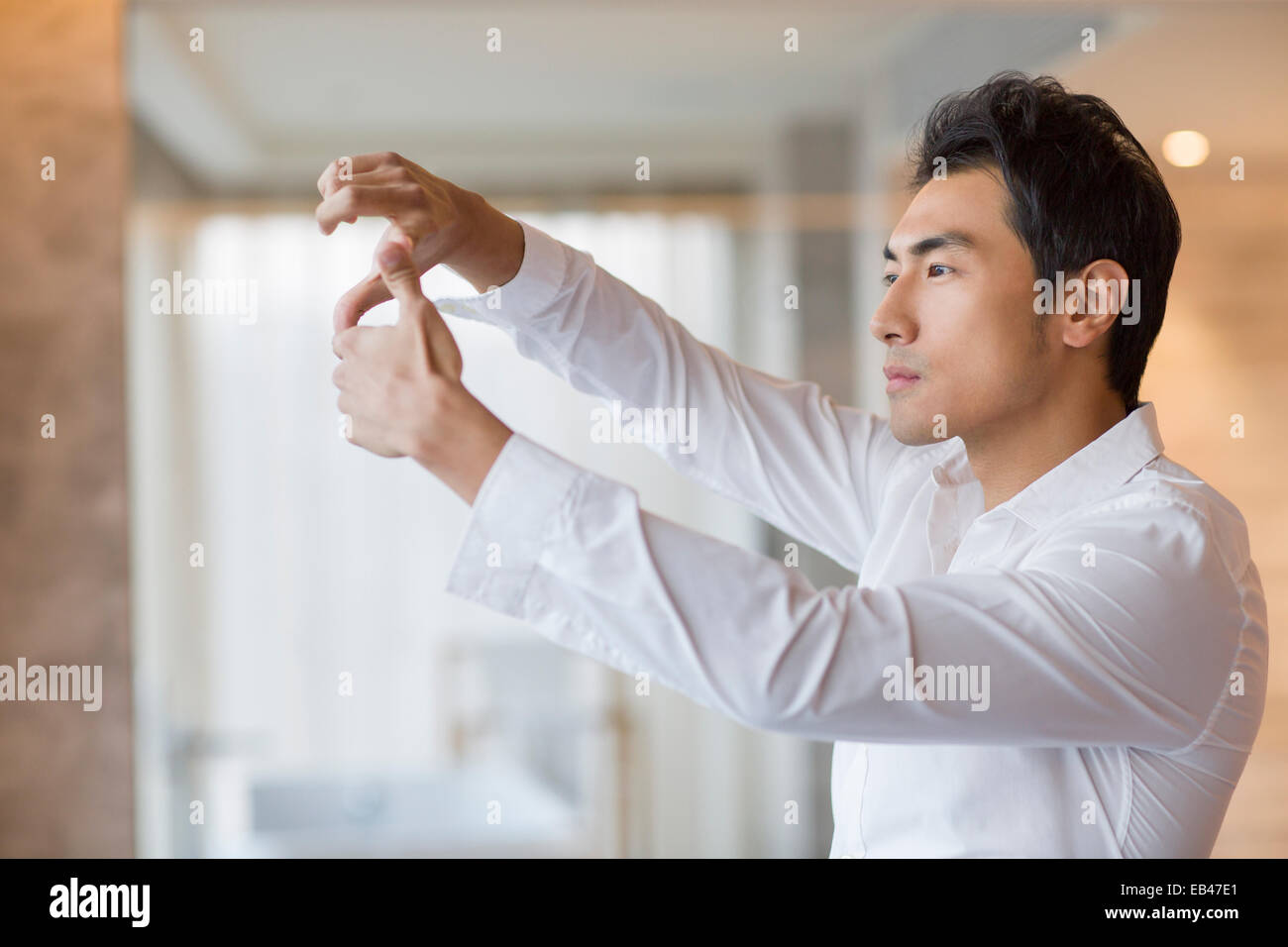 Young man making finger frame Stock Photo - Alamy