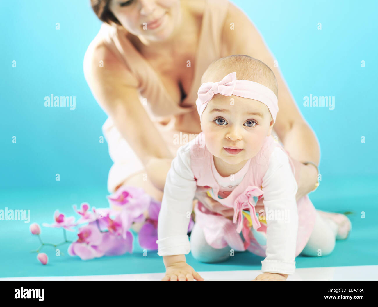 Cute little girl and her caring mother Stock Photo - Alamy