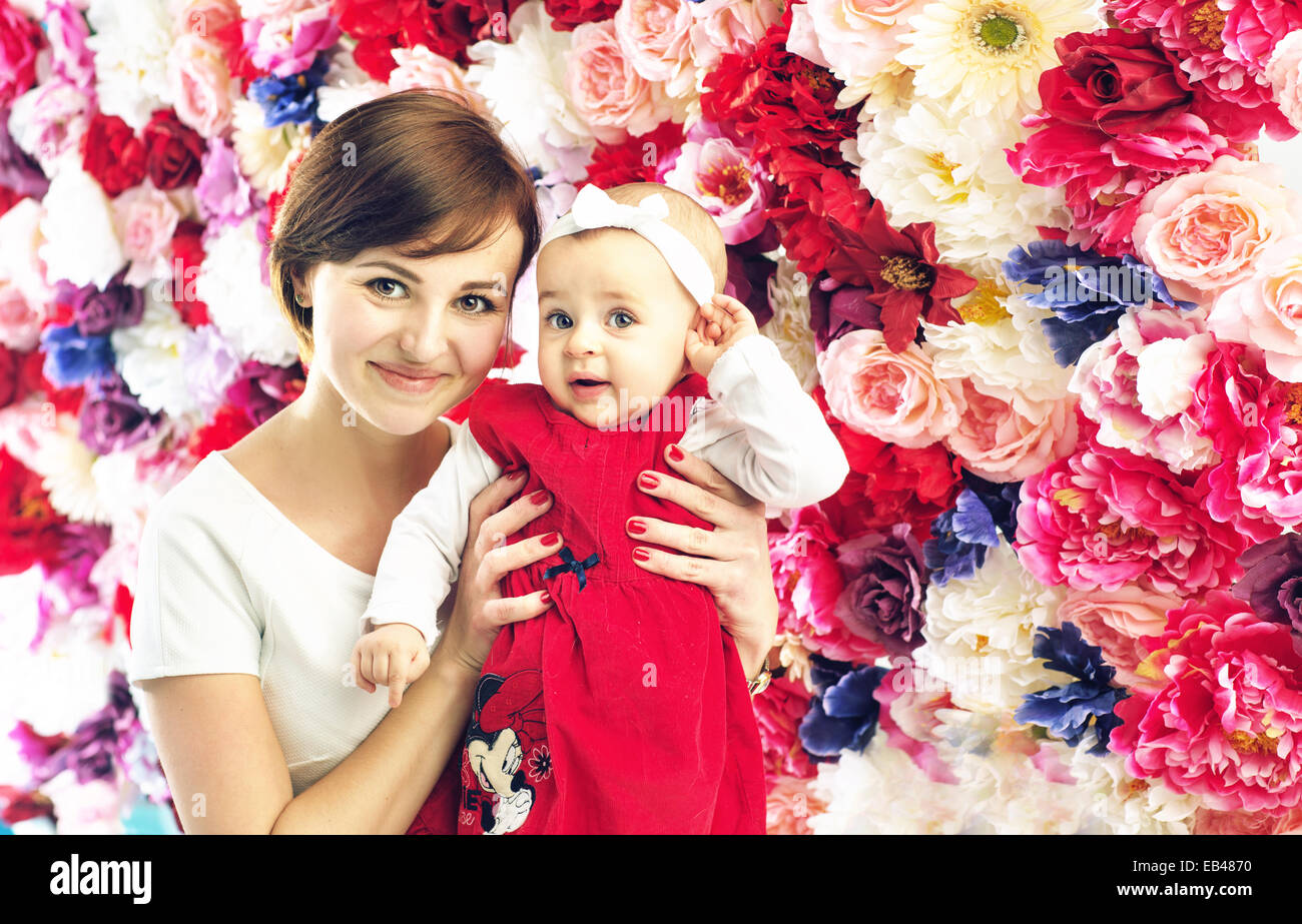 Pretty mom with smiling, cute baby Stock Photo - Alamy