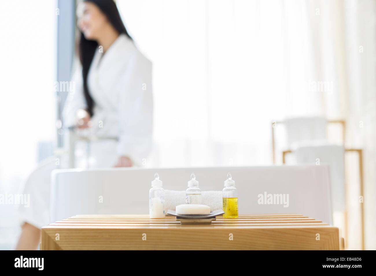 Young woman filling bathtub Stock Photo - Alamy