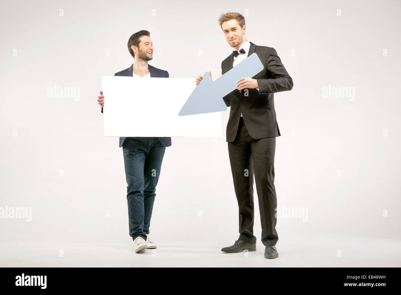 Handsome and cheerful men advertising sales Stock Photo - Alamy