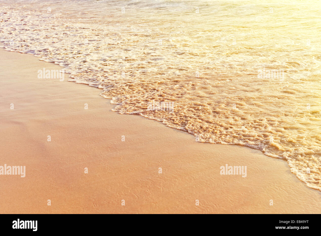 Wave of the sea on the sand beach Stock Photo - Alamy