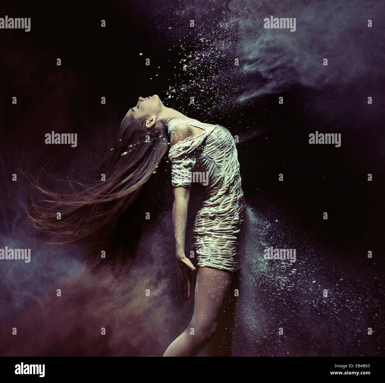 Young ballet dancer dancing with the colorful dust Stock Photo - Alamy