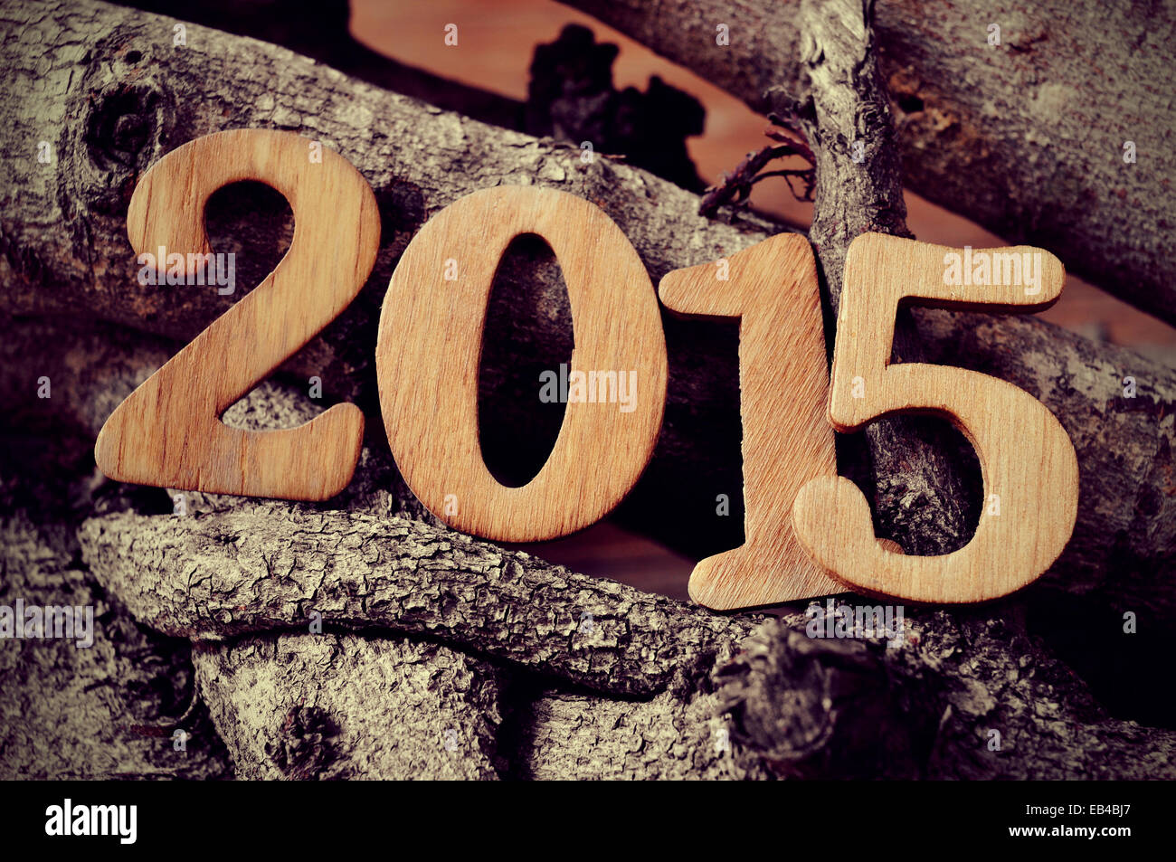 wooden numbers forming the number 2015, as the new year, with a pile of ...