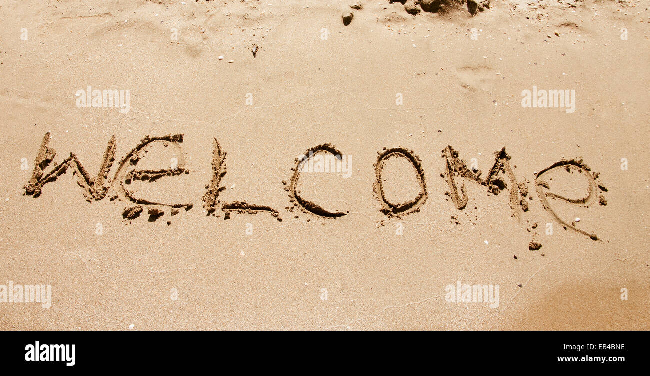 welcome written in a sandy tropical beach Stock Photo - Alamy