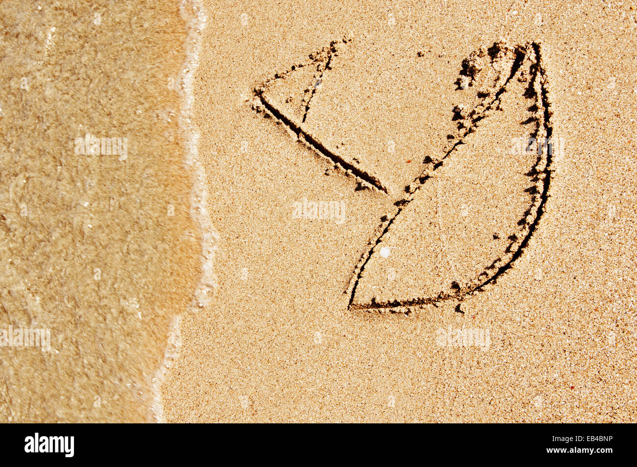 drawing of sailboat on sand Stock Photo - Alamy
