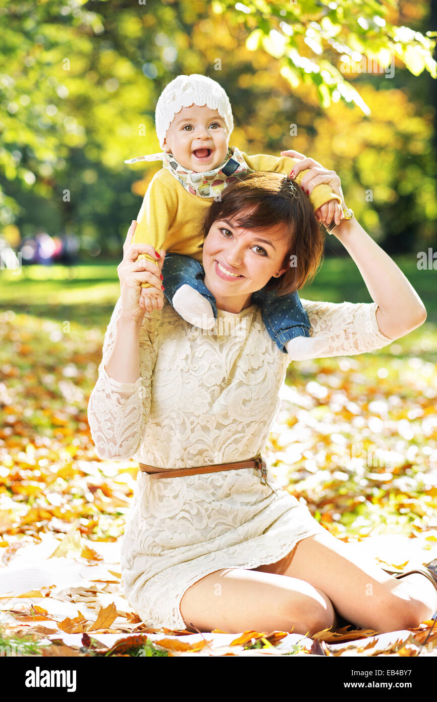 Smiling lady with laughing baby Stock Photo - Alamy
