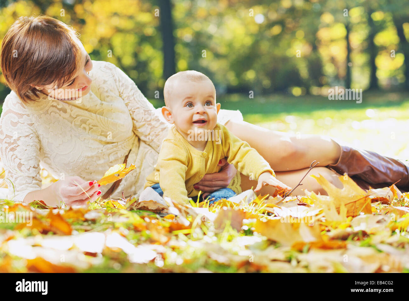 Woman looking after child hi-res stock photography and images - Alamy
