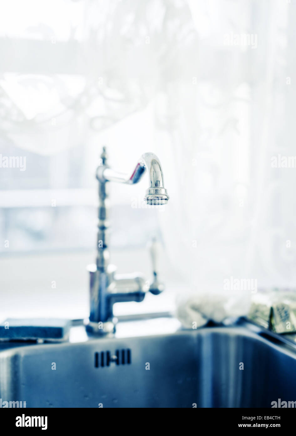 Water tap in the kitchen Stock Photo - Alamy