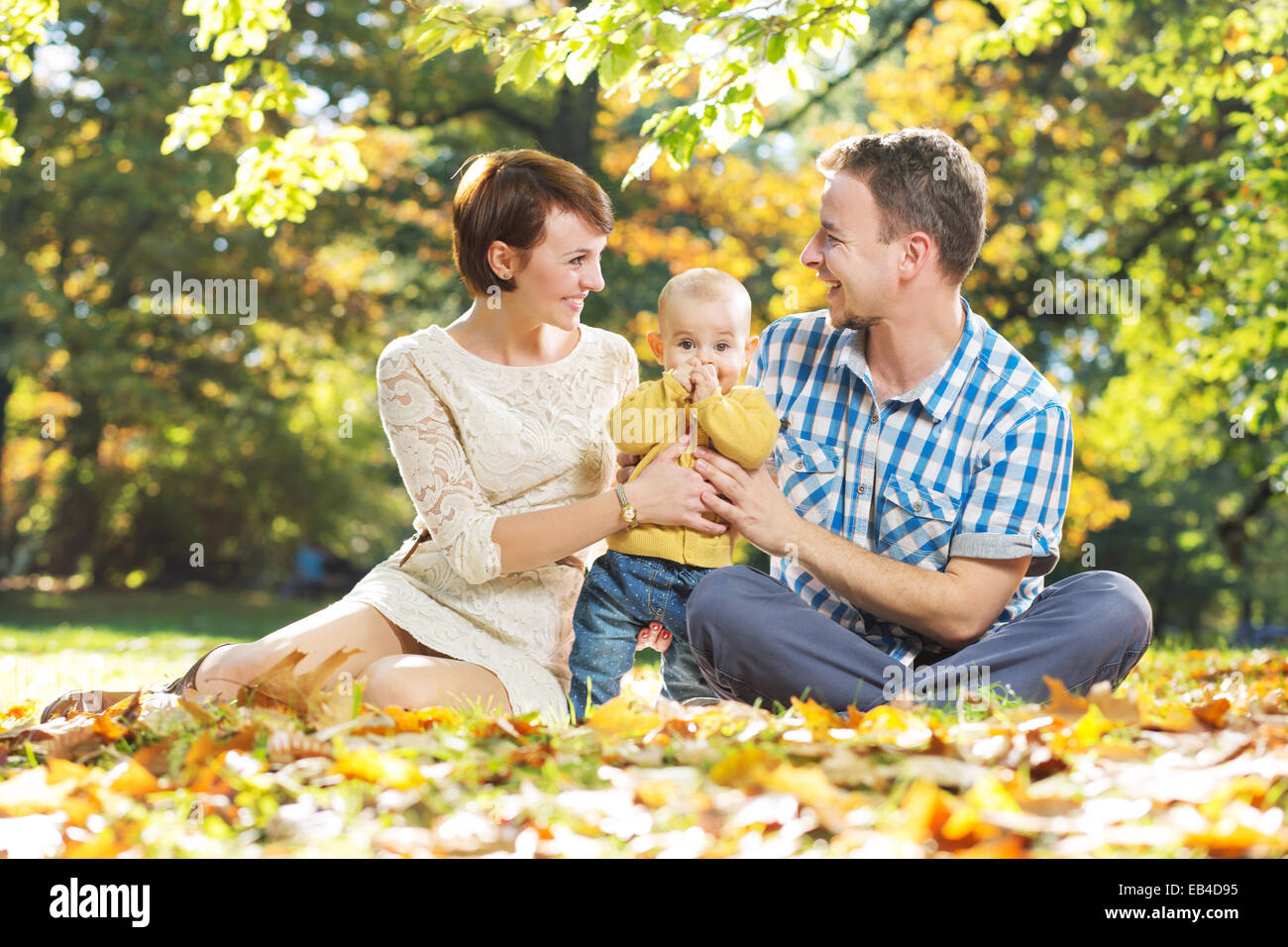 Portrait of parents with beloved baby Stock Photo - Alamy