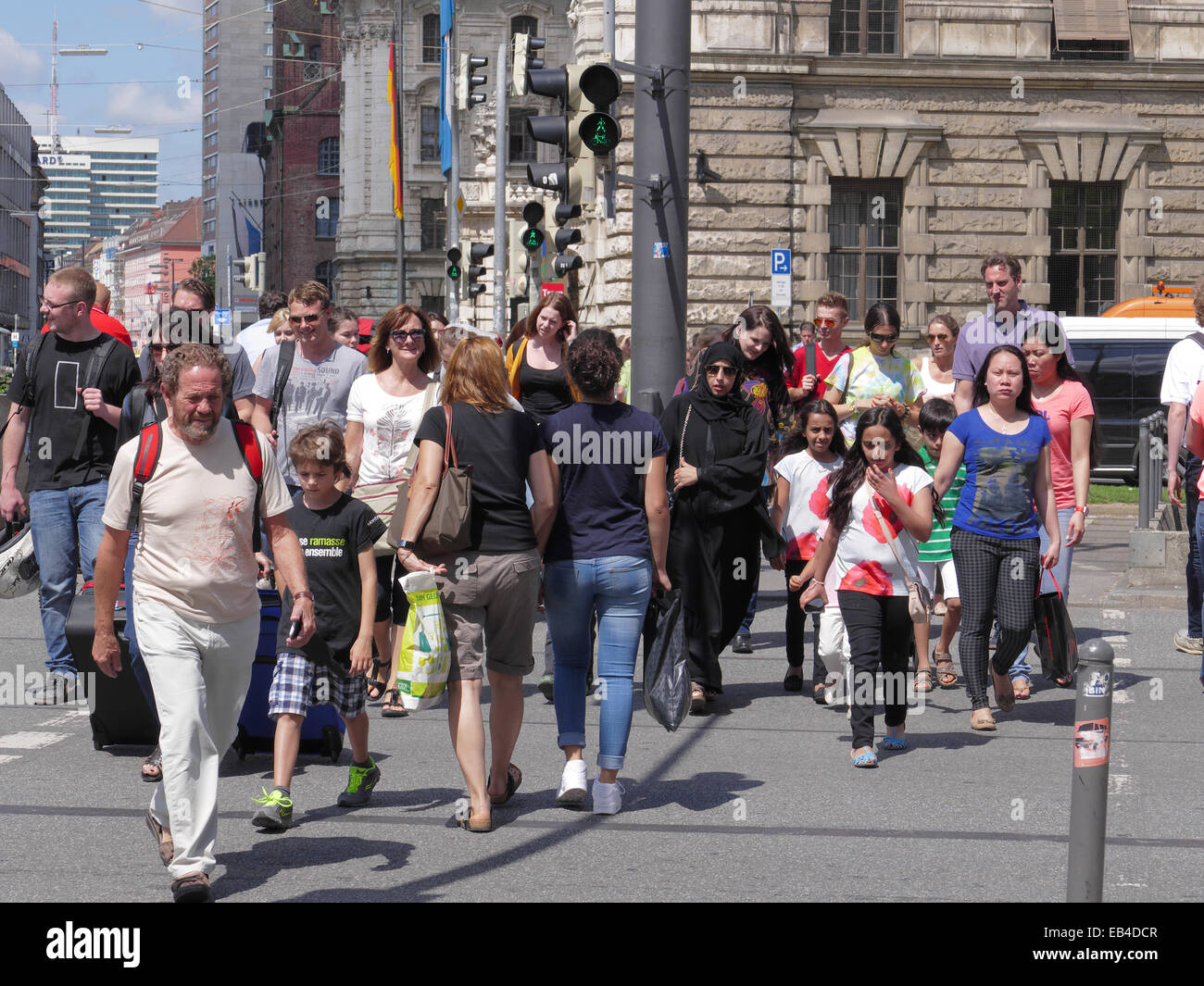 Pedestrians Arabic tourist crossing Zebra Road Downtown Munich Germany ...
