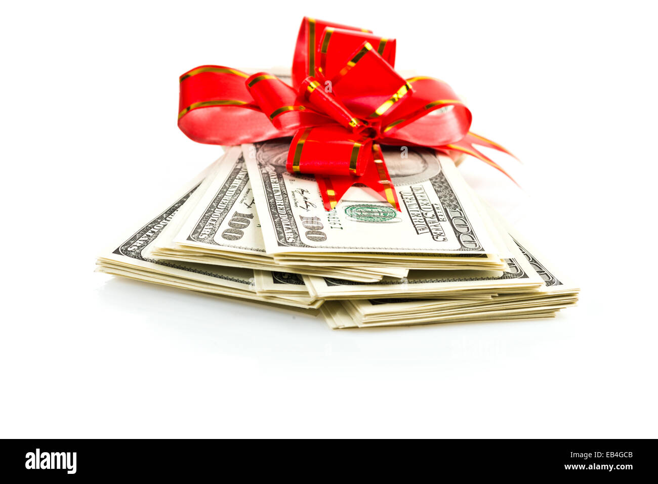 Money gift (big stack of dollars with red bow isolated on white ...