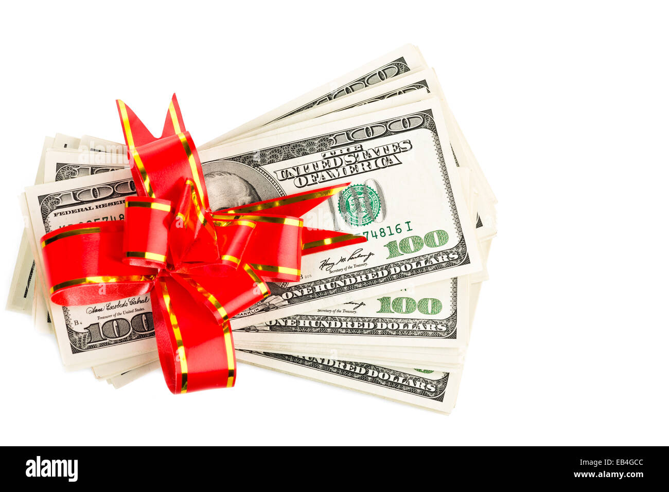 Money gift (big stack of dollars with red bow isolated on white ...