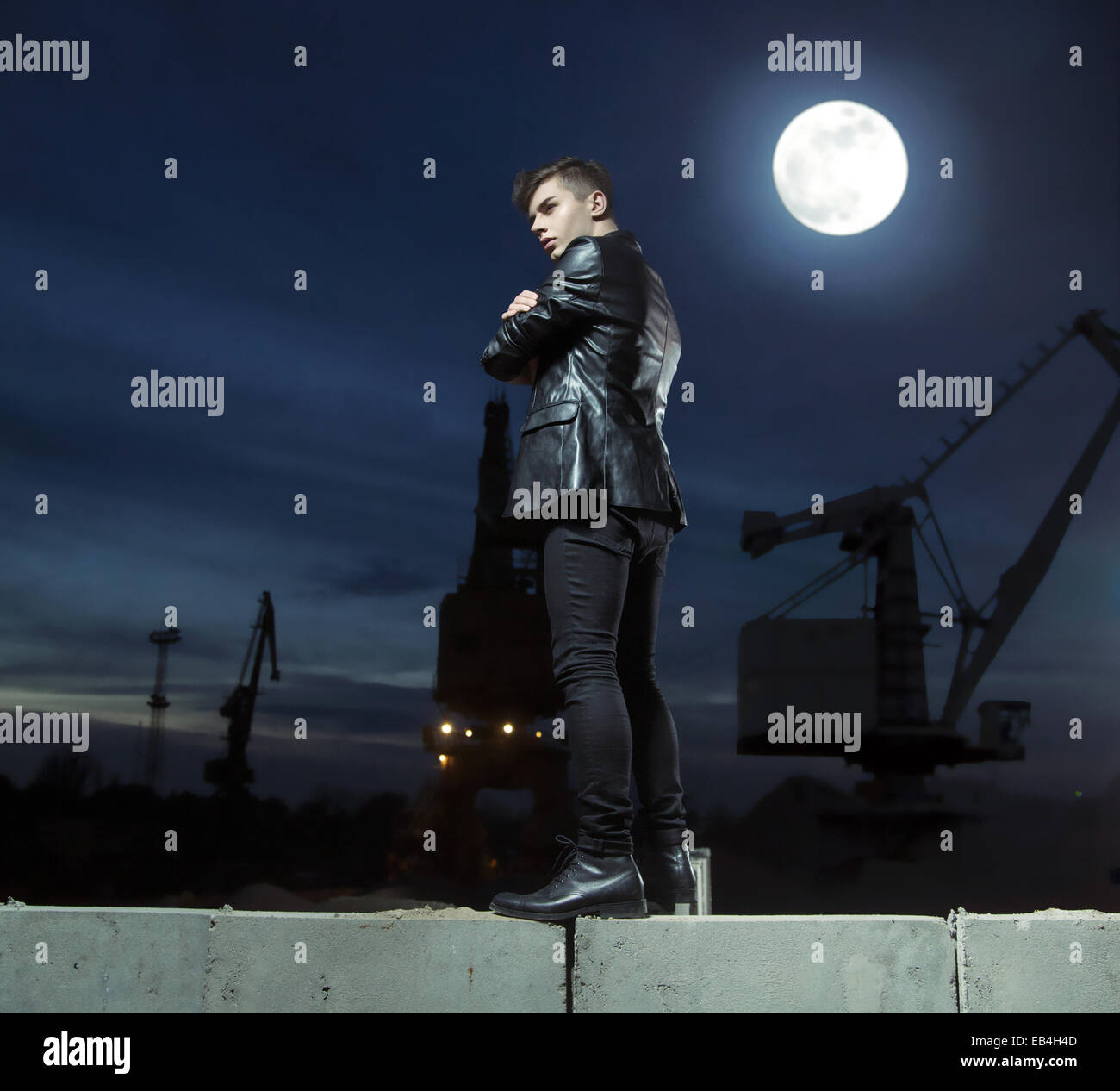 Handsome young man over the building background Stock Photo - Alamy