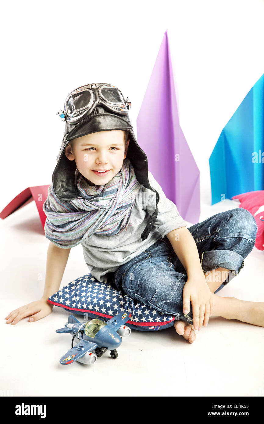 Cute little pilot playing toy planes Stock Photo - Alamy