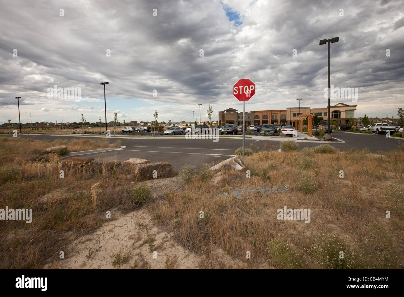A Stop sign at the end of a non-existent road near a strip mall Stock ...