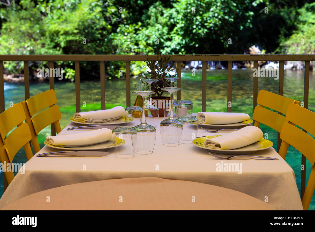 Restaurant table by the river Stock Photo - Alamy