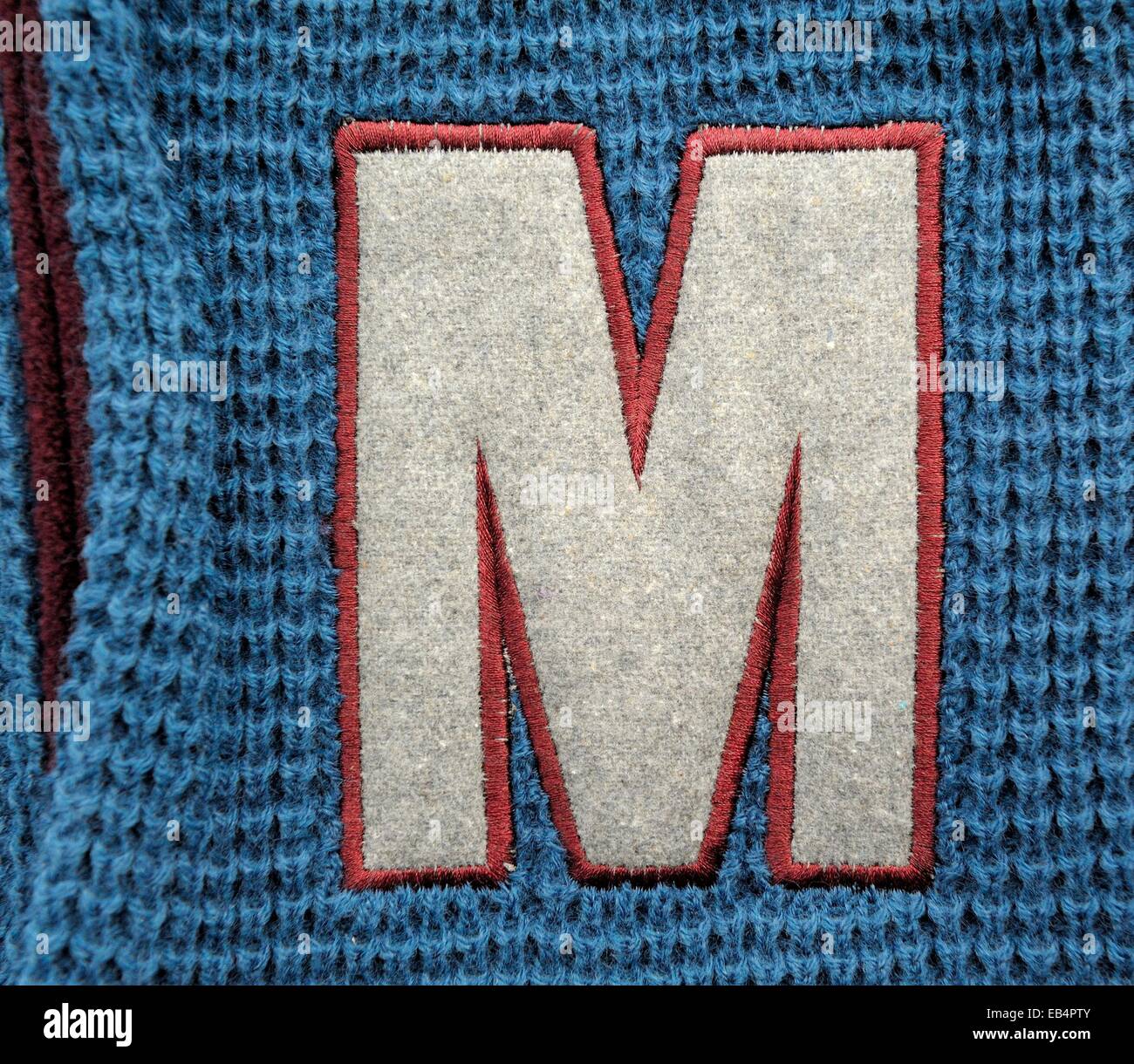 The letter M on scarf Stock Photo - Alamy