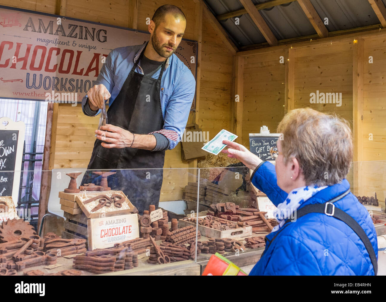The vendor of Amazing Chocolate market stall selling his produce to a ...