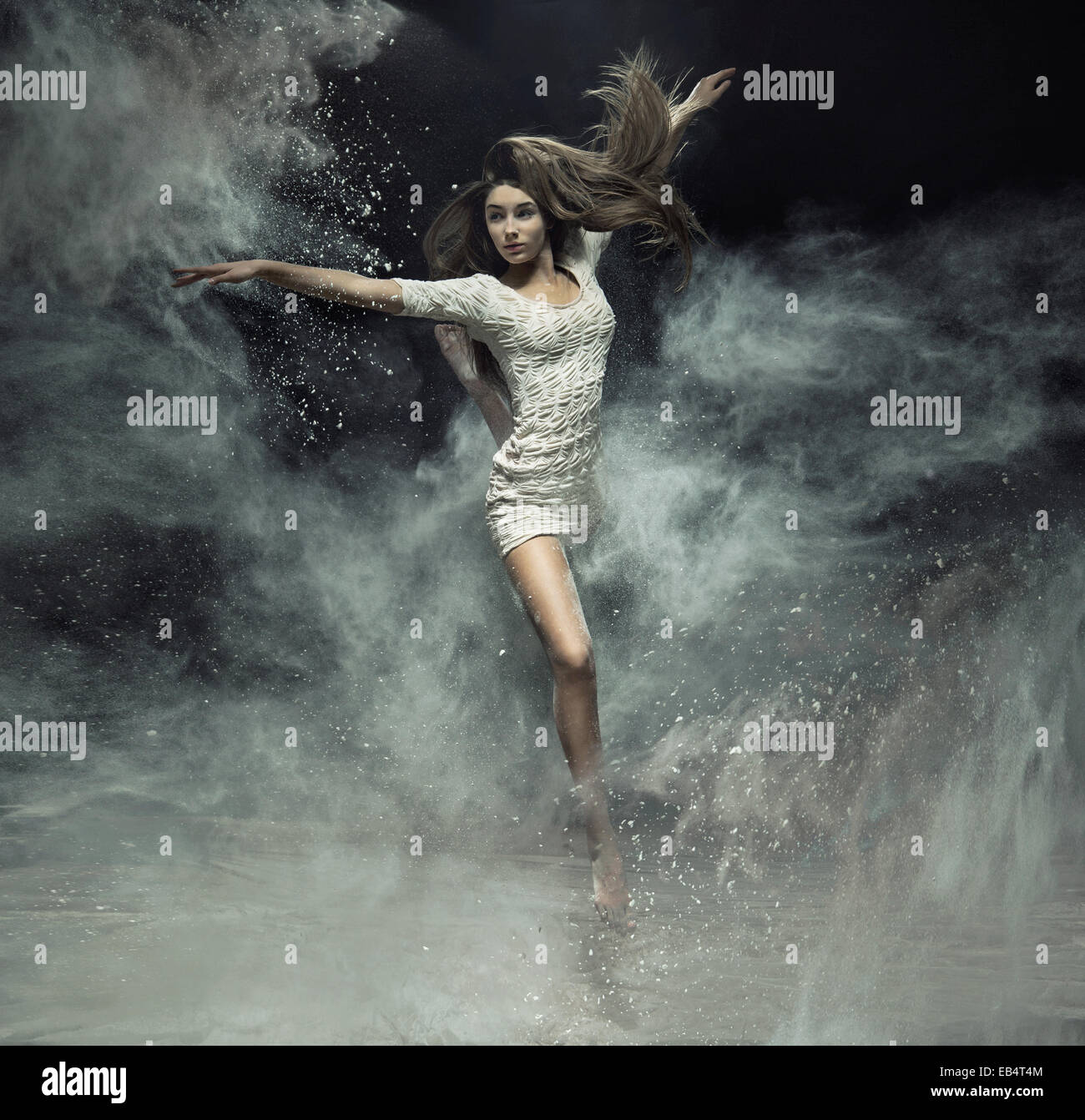 Talented ballet dancer catching the white dust Stock Photo - Alamy
