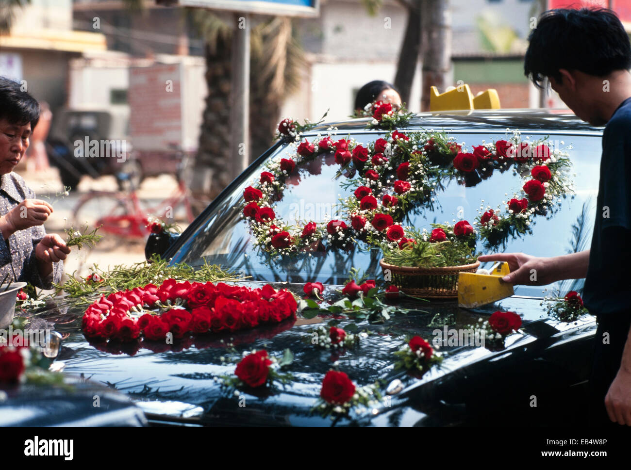 local people decorate a car for a traditional wedding ceremony in china ...