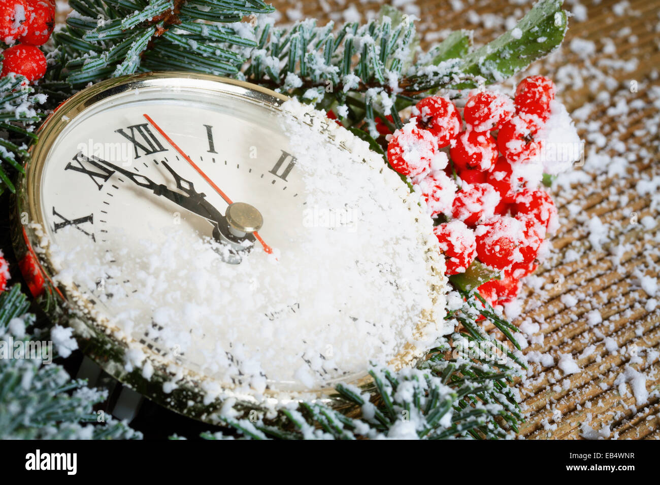 Christmas clock with winter decoration Stock Photo - Alamy