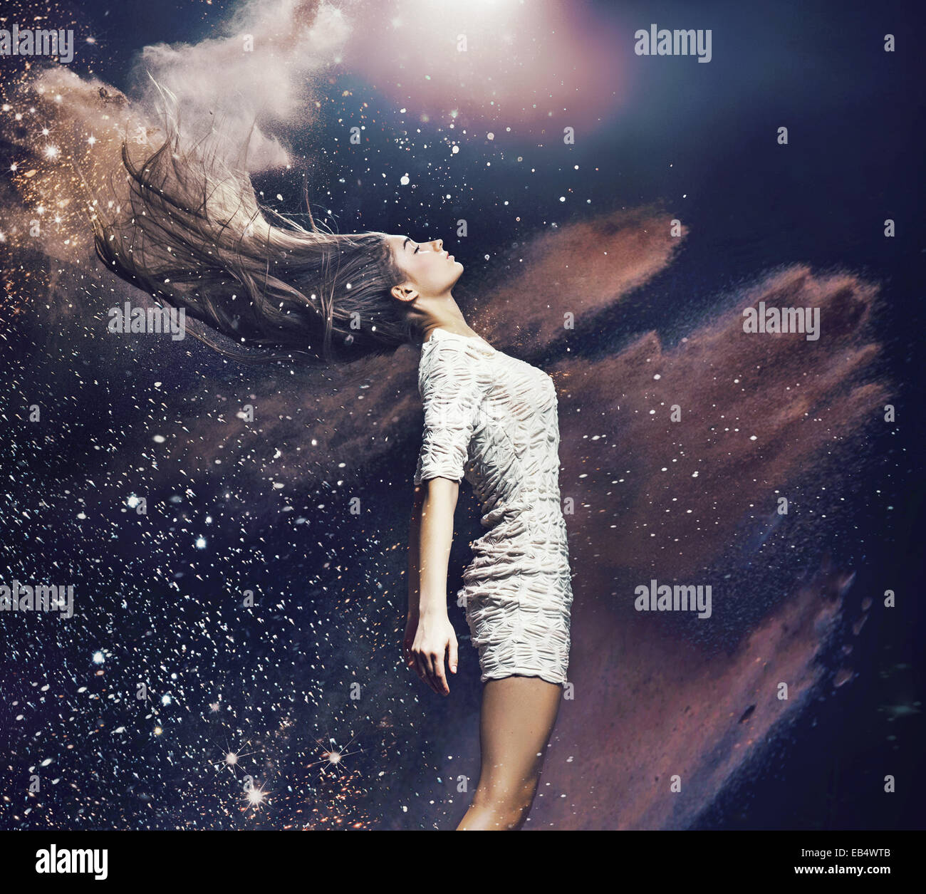 Art picture of the ballet dancer among colorful dust Stock Photo - Alamy