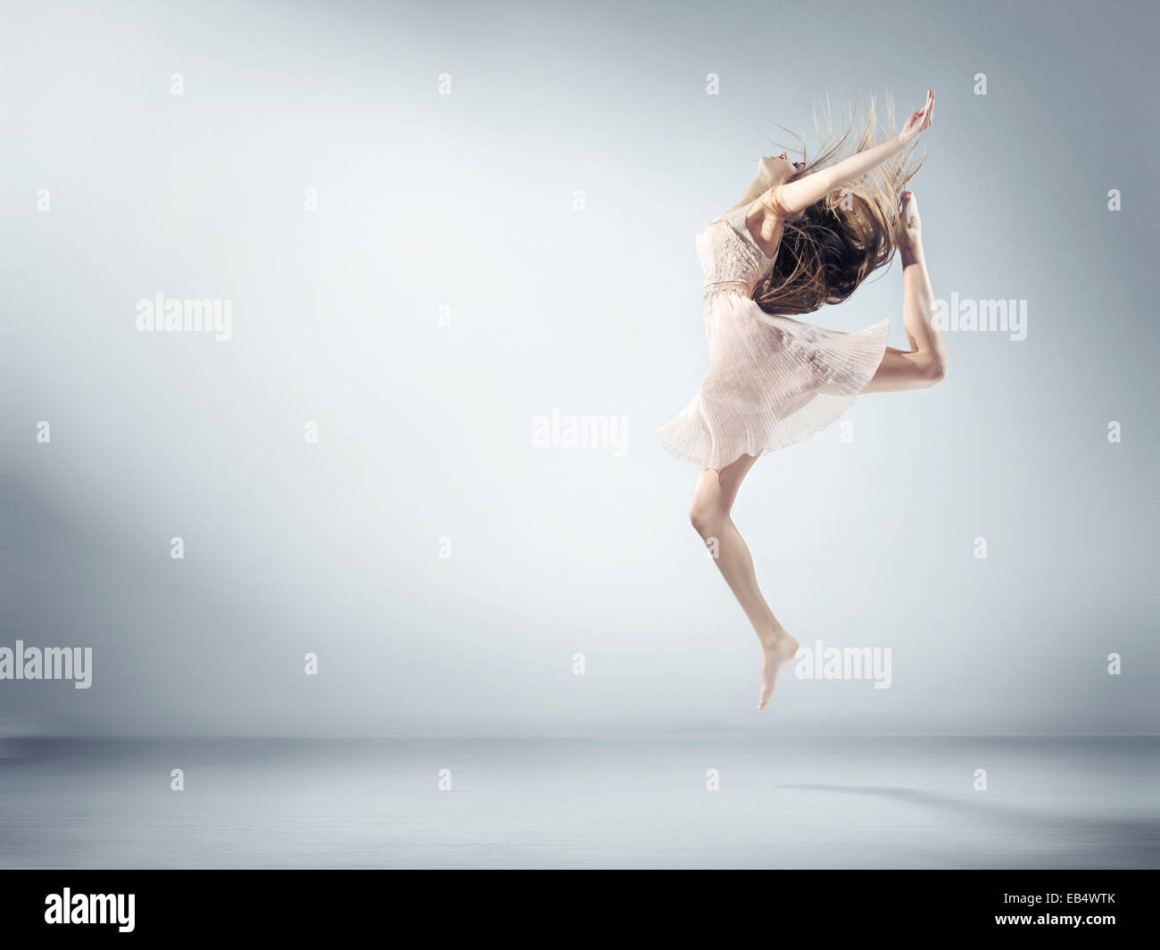 Flexible young woman in ballet figure Stock Photo - Alamy